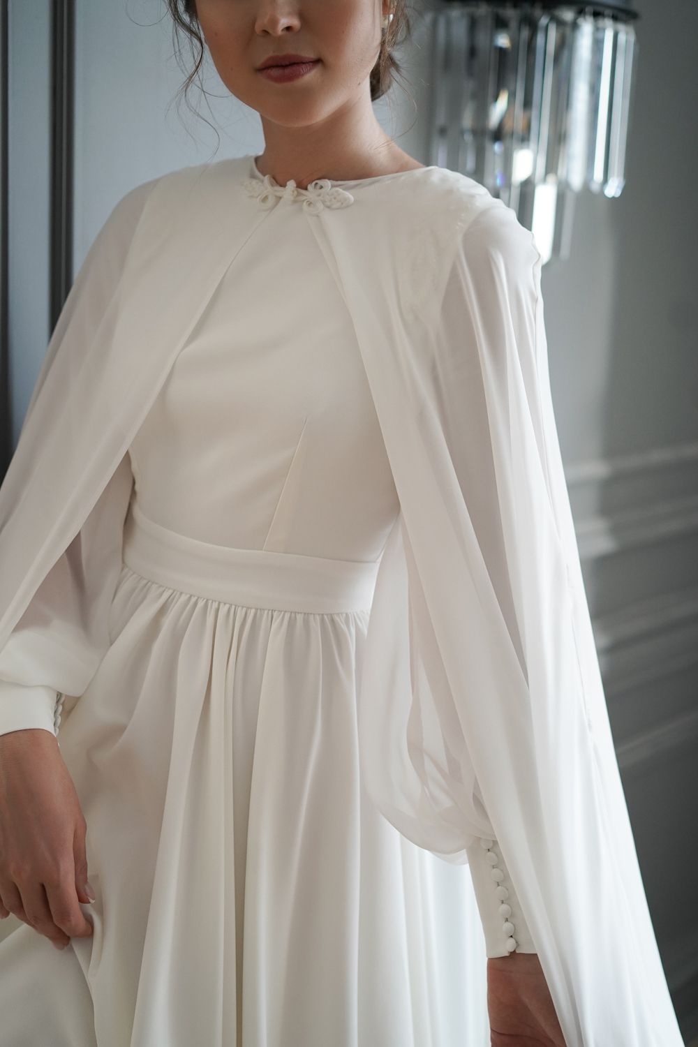 Cape with slits for hands