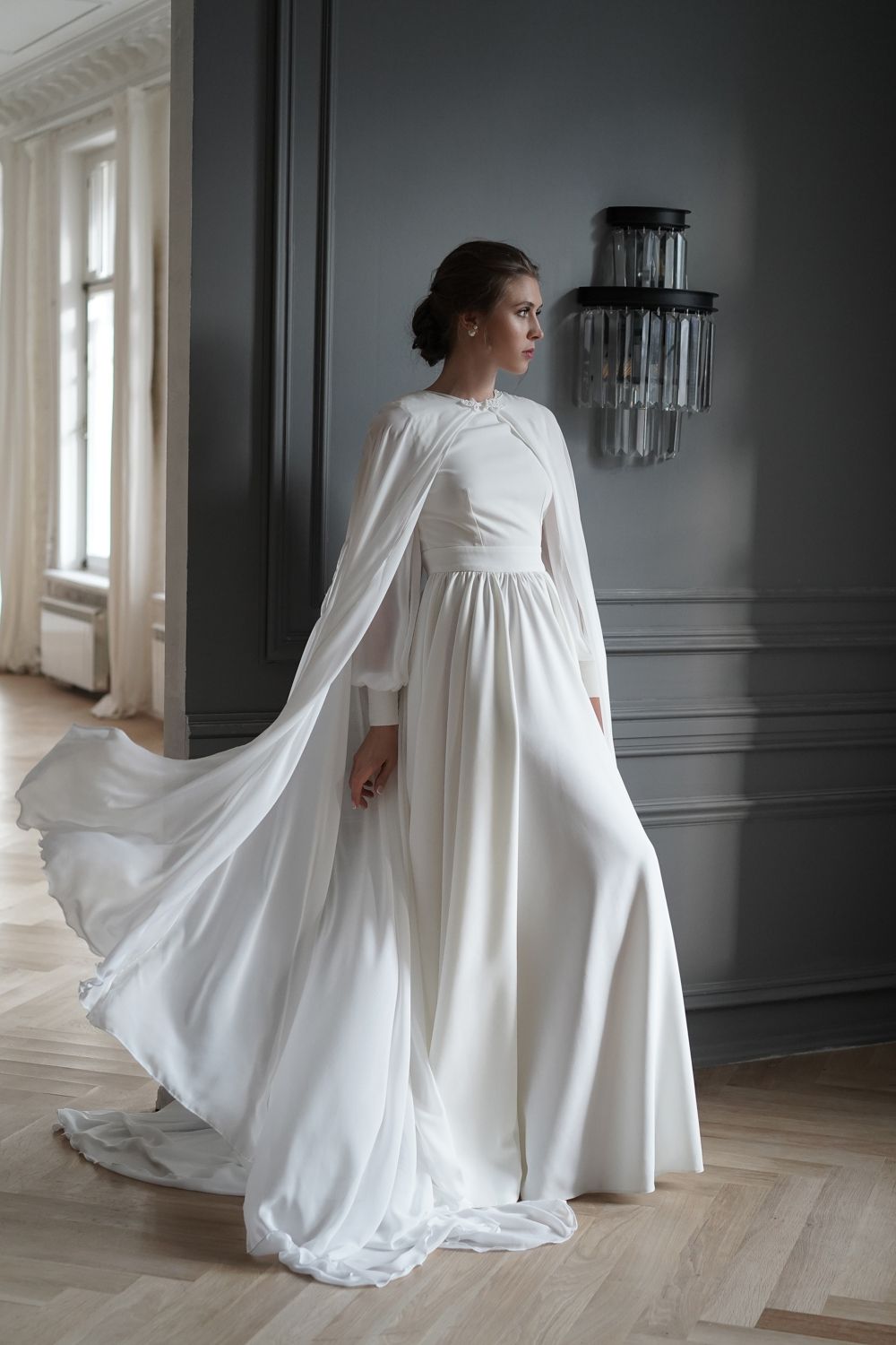 Cape with slits for hands