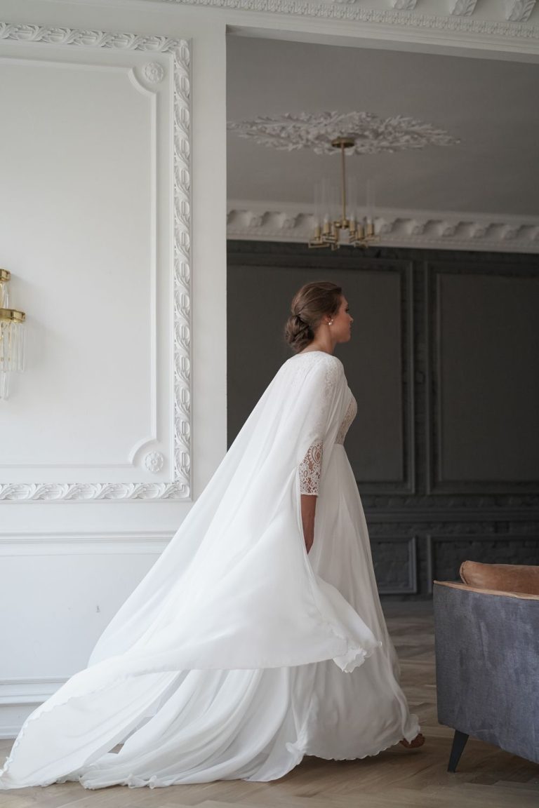 Cape with slits for hands