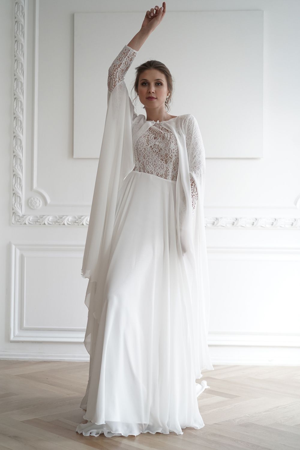 Cape with slits for hands
