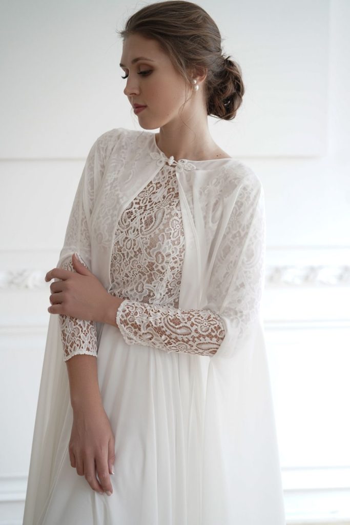 Cape with slits for hands