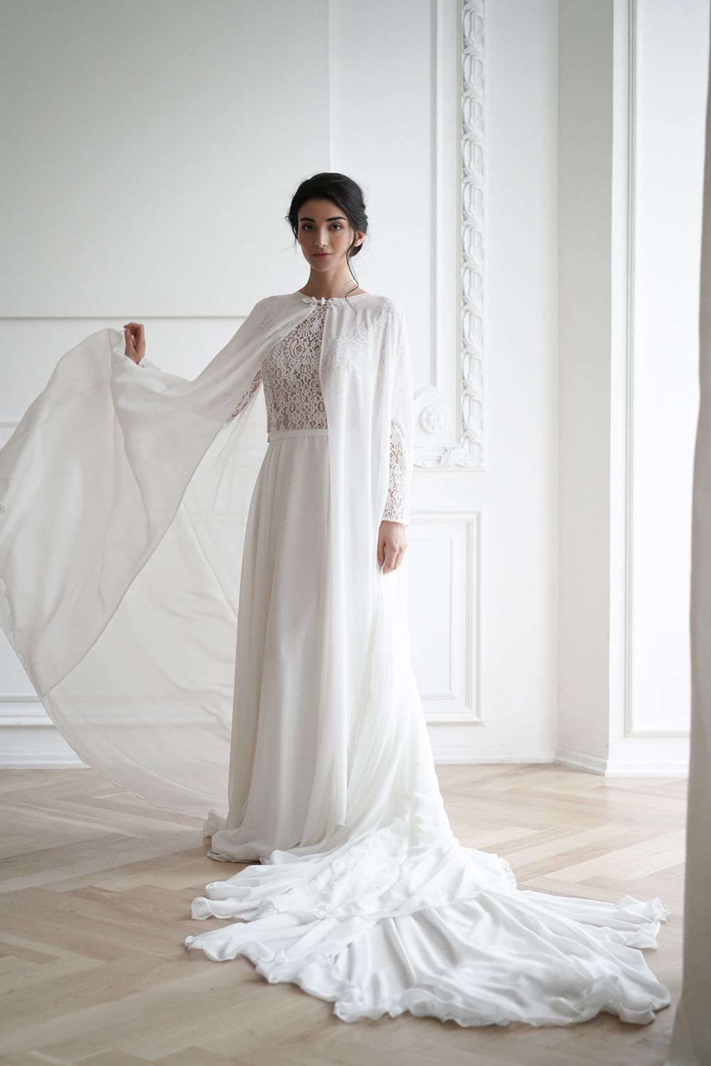 Cape with slits for hands